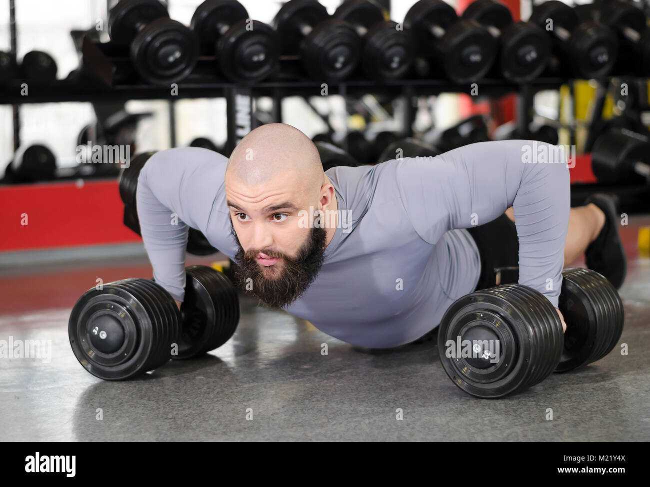 Strong young man doing push-ups, building muscles, living active ...