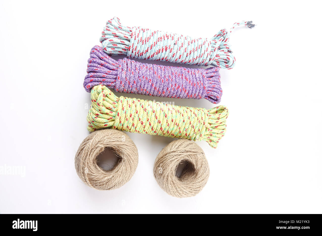 Various colour of ropes isolated on white background Stock Photo - Alamy