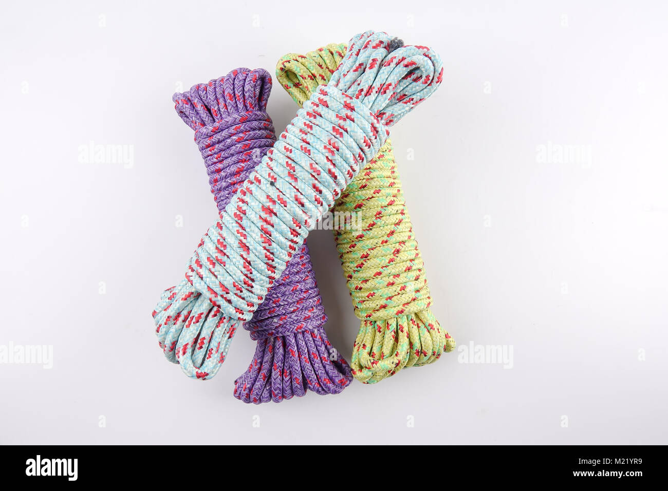Various colour of ropes isolated on white background Stock Photo - Alamy