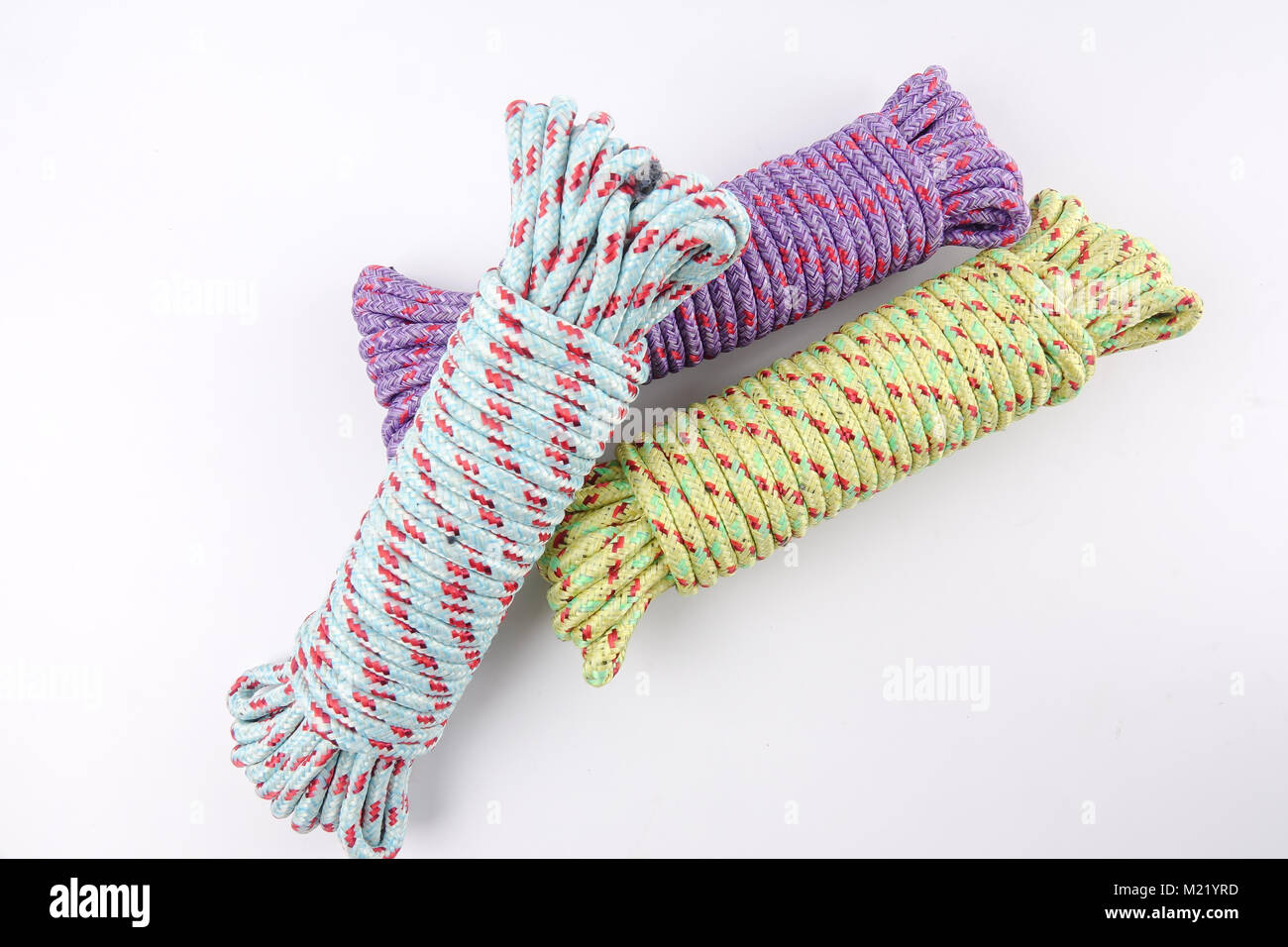 Various colour of ropes isolated on white background Stock Photo - Alamy