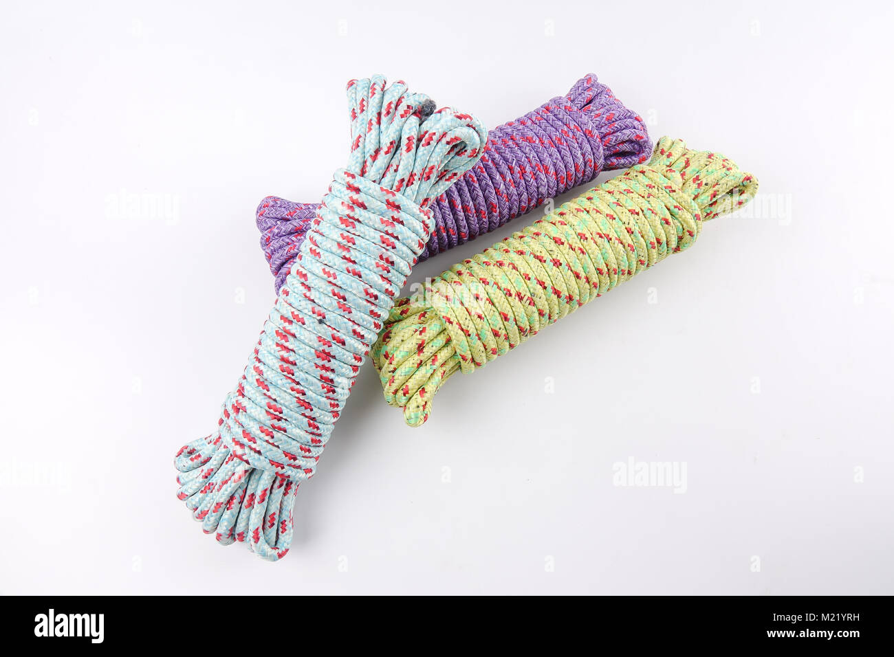 Various colour of ropes isolated on white background Stock Photo - Alamy