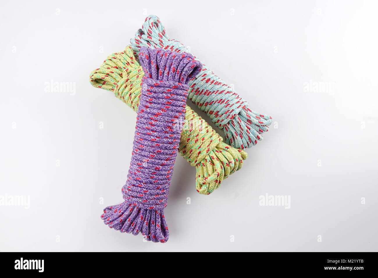 Various colour of ropes isolated on white background Stock Photo - Alamy