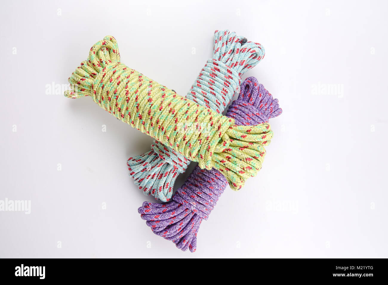 Various colour of ropes isolated on white background Stock Photo - Alamy