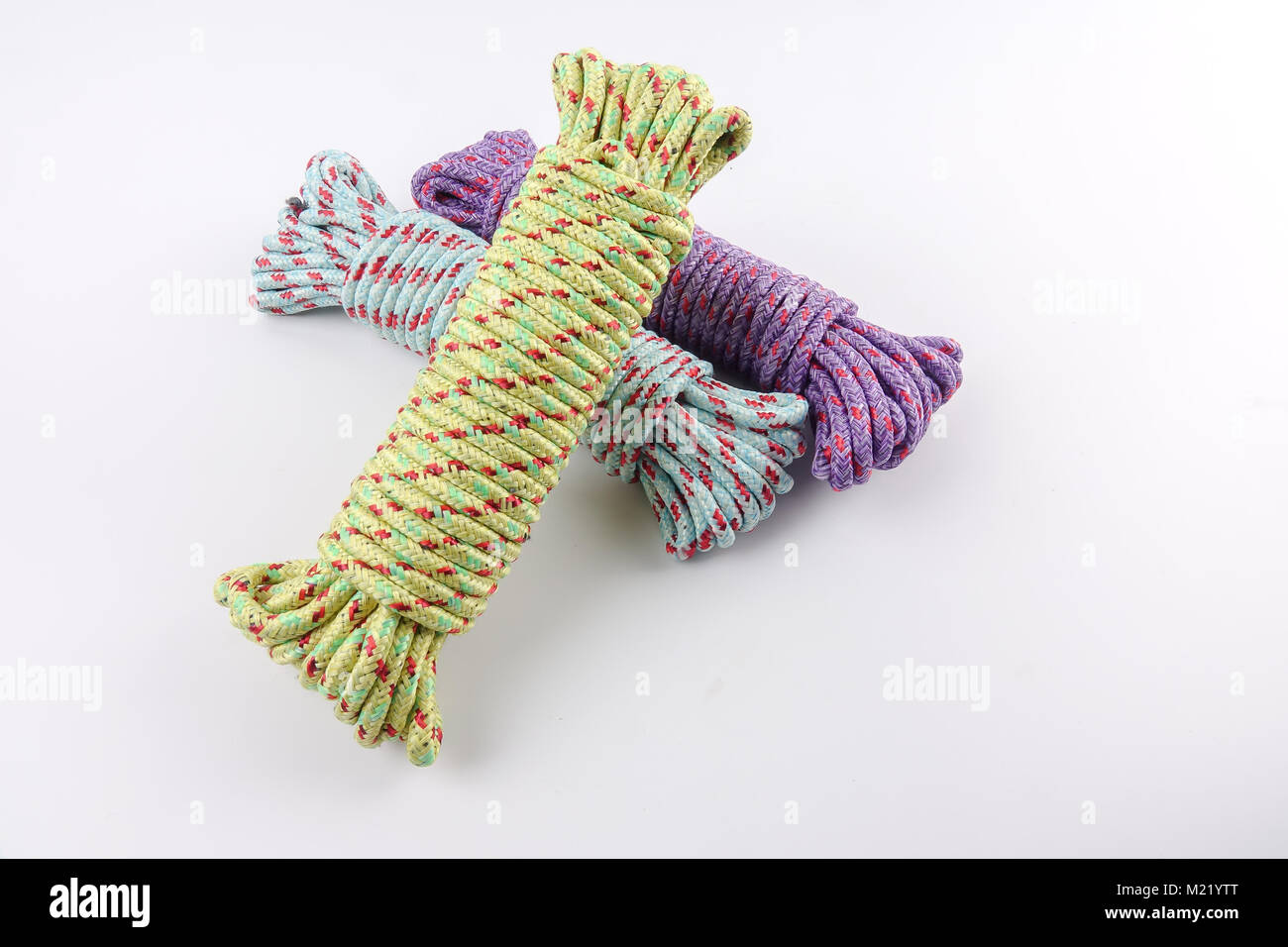 Various colour of ropes isolated on white background Stock Photo - Alamy