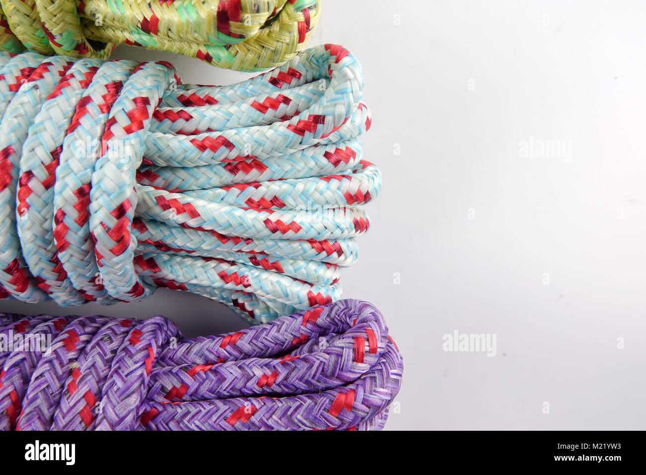 Various colour of ropes isolated on white background Stock Photo - Alamy