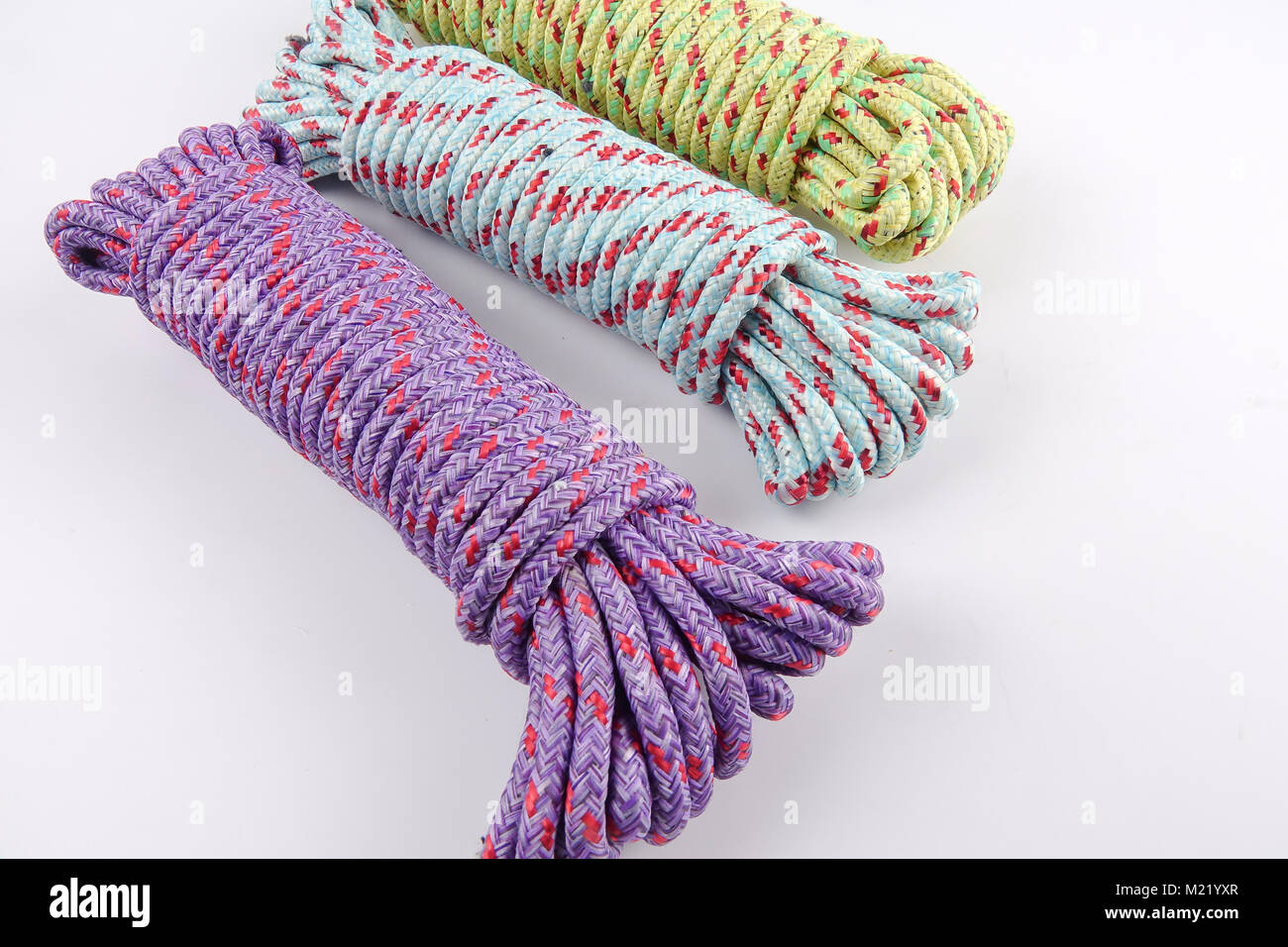 Various colour of ropes isolated on white background Stock Photo - Alamy