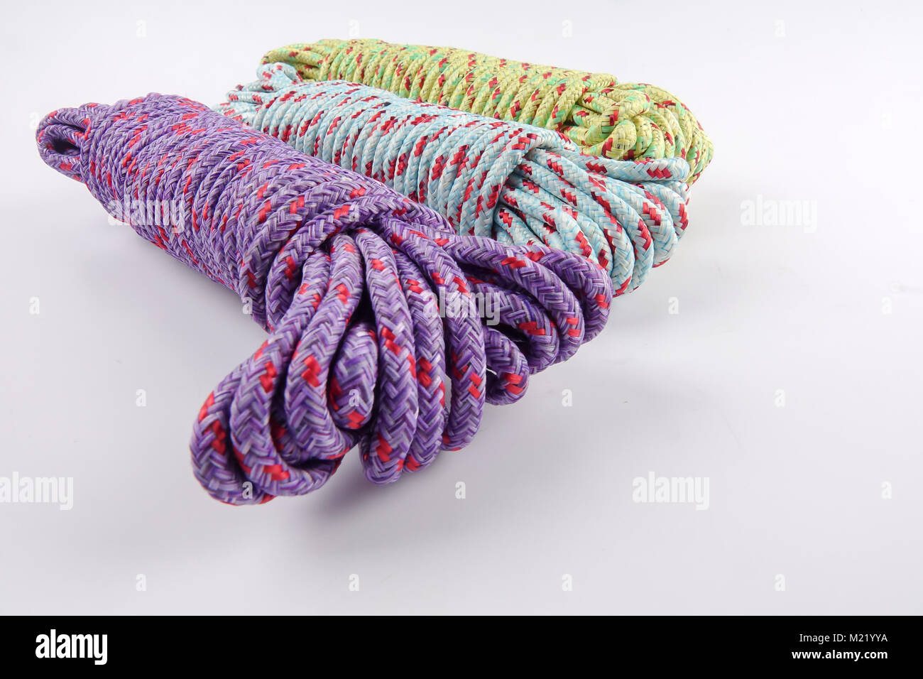 Various colour of ropes isolated on white background Stock Photo - Alamy