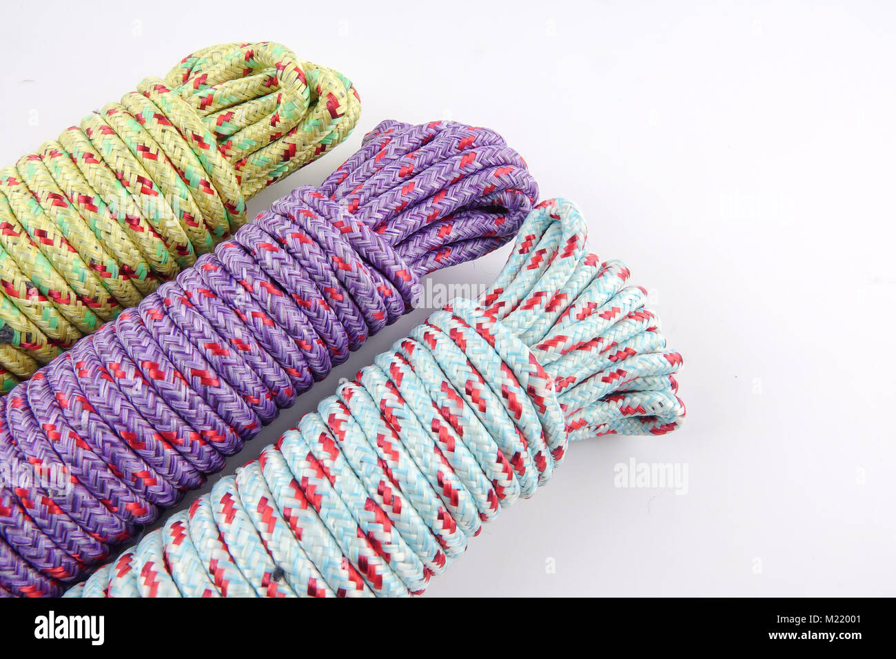 Various colour of ropes isolated on white background Stock Photo - Alamy
