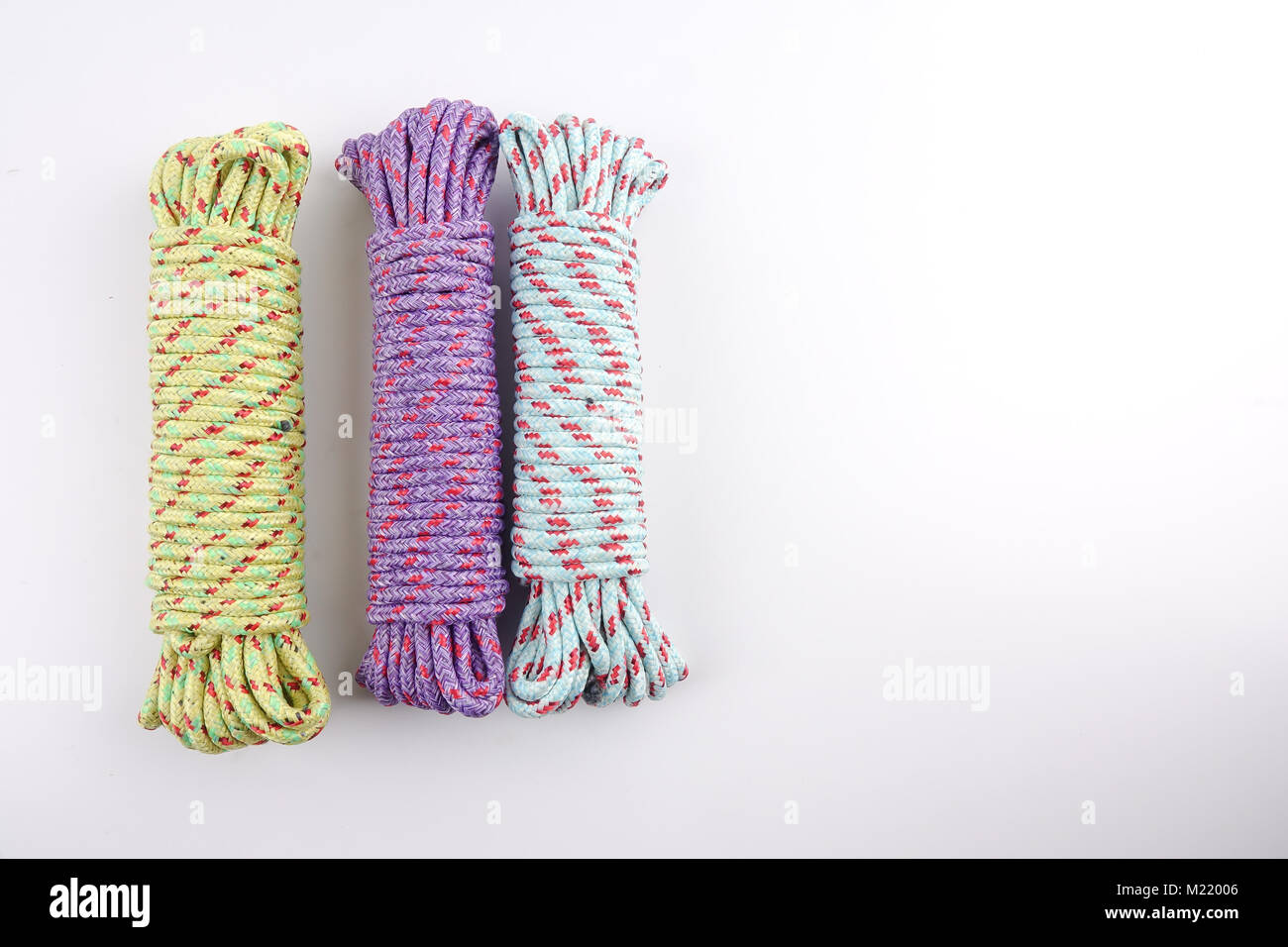 Various colour of ropes isolated on white background Stock Photo - Alamy
