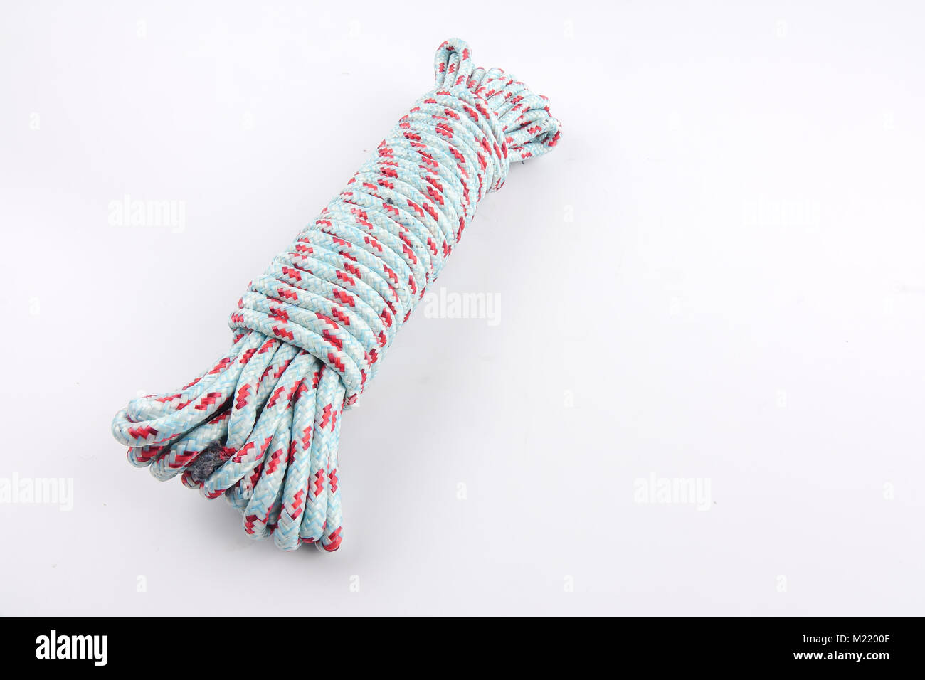 Various colour of ropes isolated on white background Stock Photo - Alamy