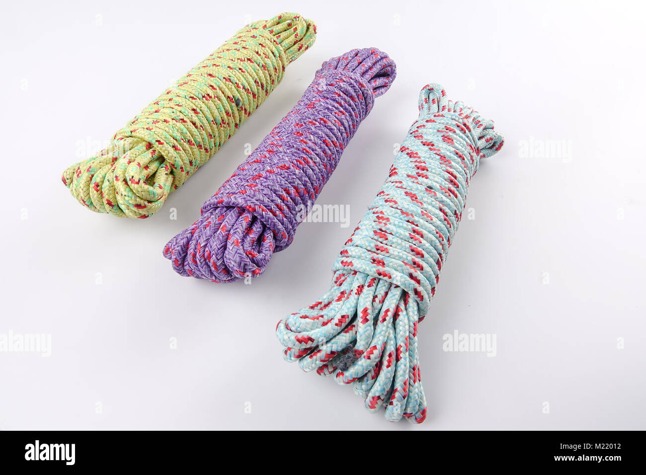 Various colour of ropes isolated on white background Stock Photo - Alamy