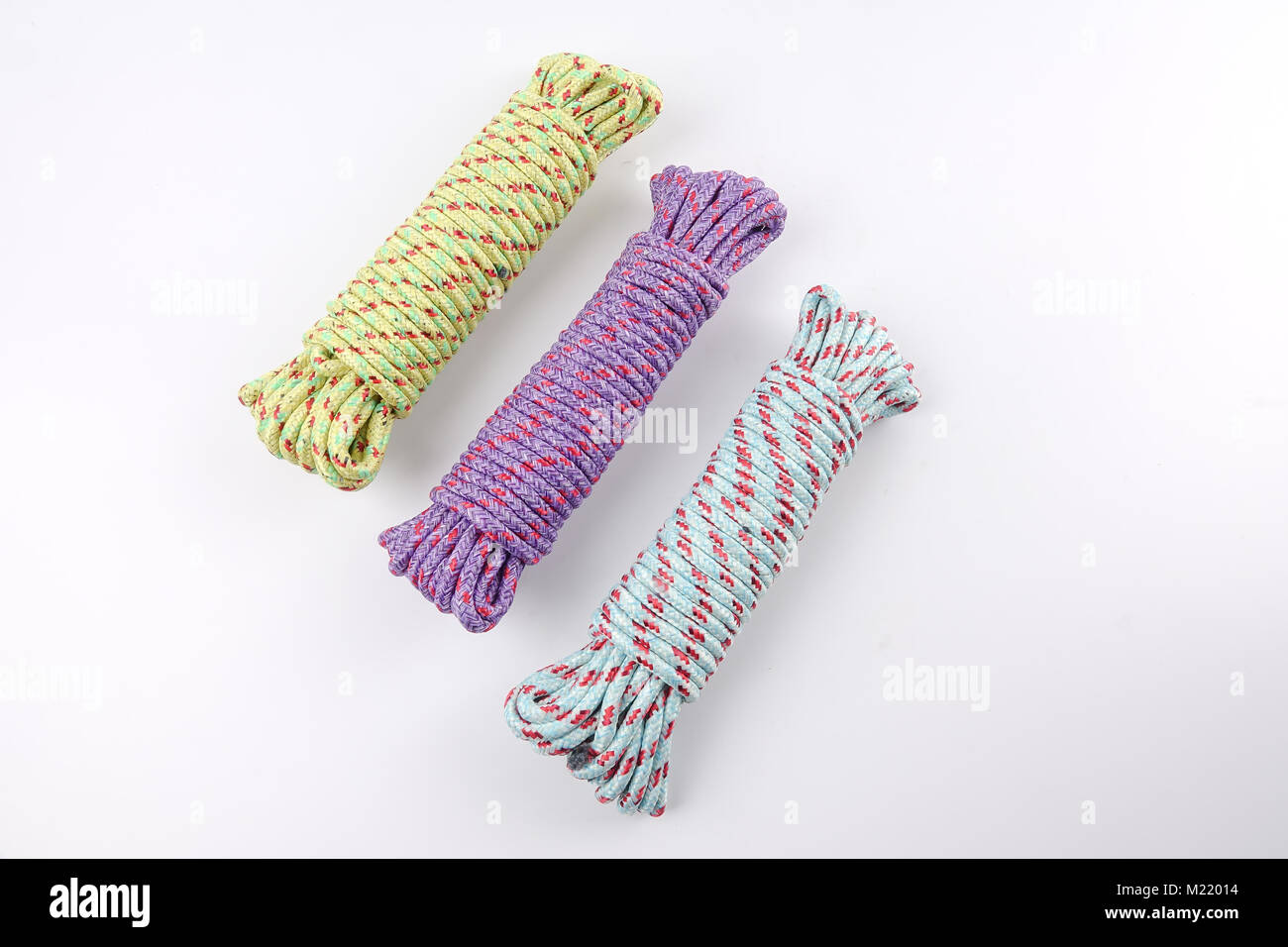 Various colour of ropes isolated on white background Stock Photo - Alamy
