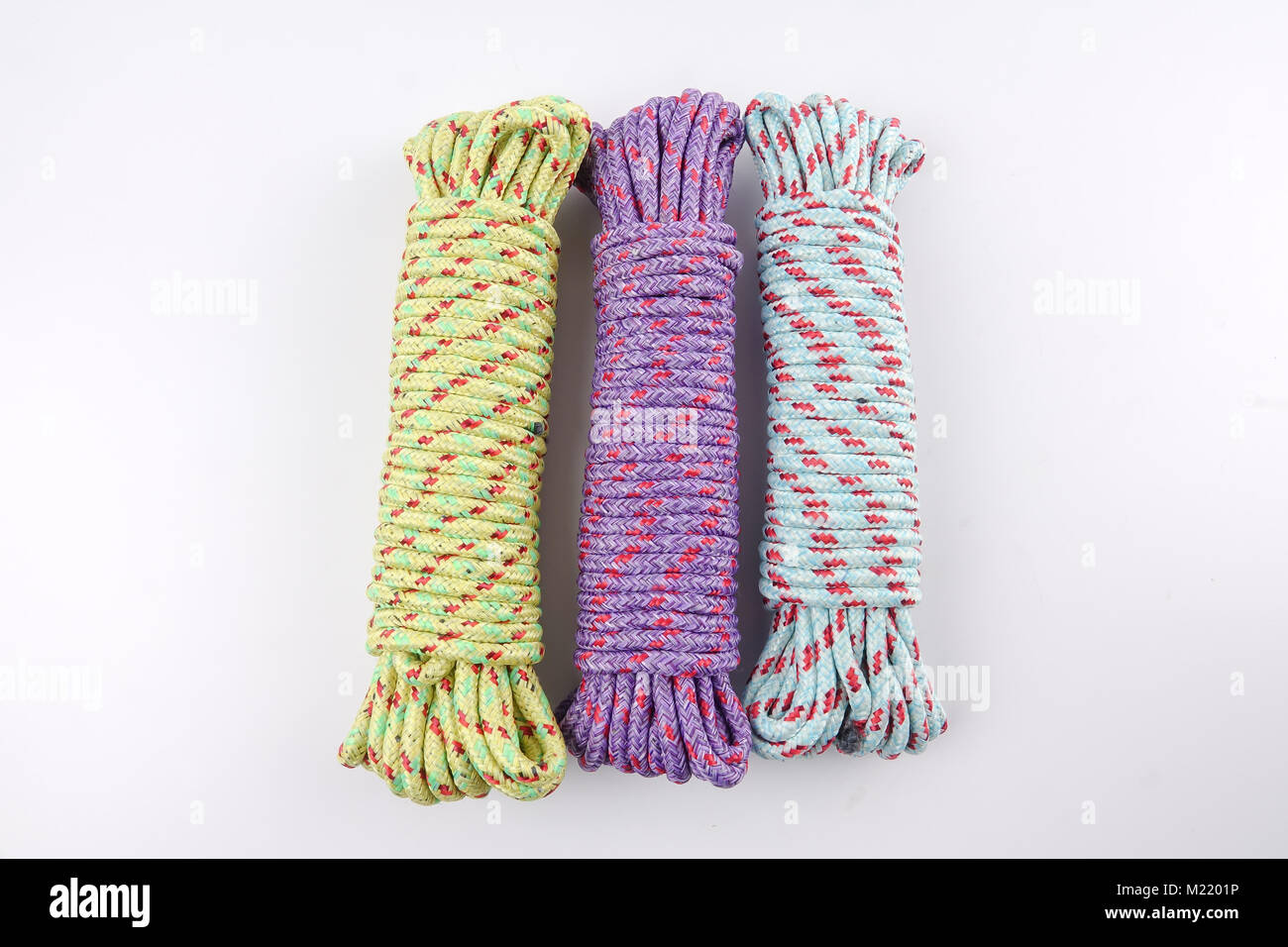 Various colour of ropes isolated on white background Stock Photo - Alamy