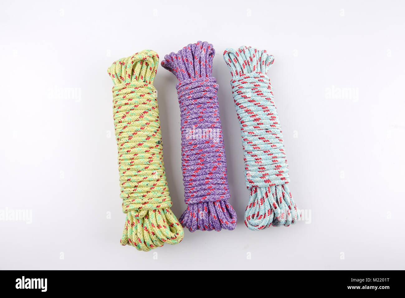 Various colour of ropes isolated on white background Stock Photo - Alamy
