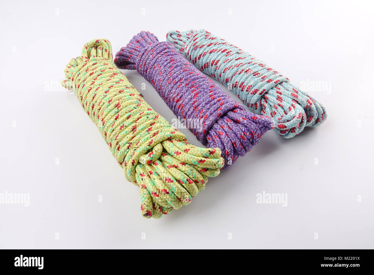 Various colour of ropes isolated on white background Stock Photo - Alamy