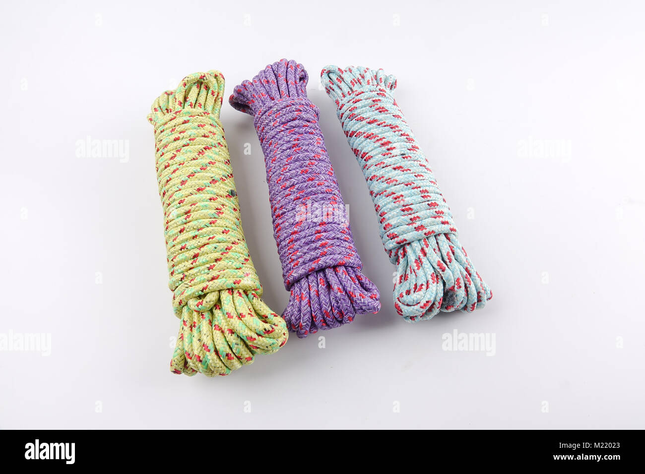 Various colour of ropes isolated on white background Stock Photo - Alamy