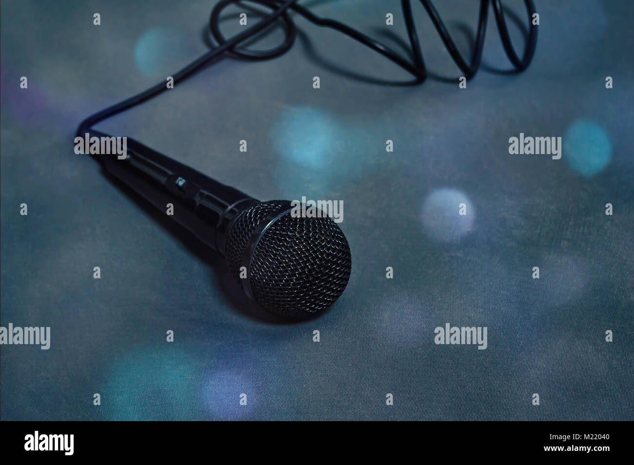 Closeup of a microphone with bokeh lights. Microphone lying on the ...