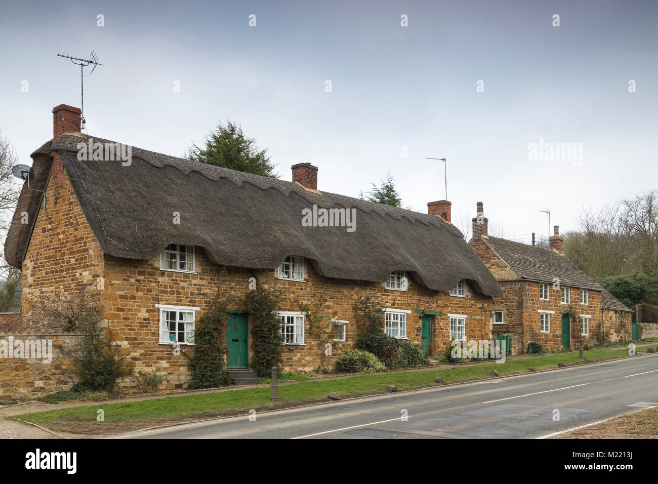 An image of three homes with thatches and slates for their roofing ...