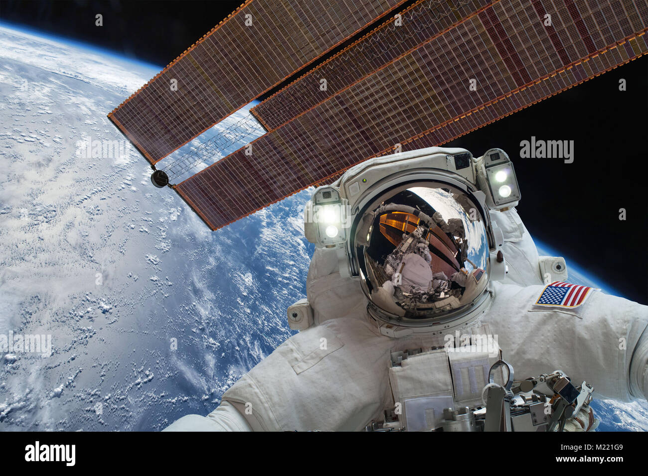 Astronaut in outer space against the backdrop of the planet earth ...