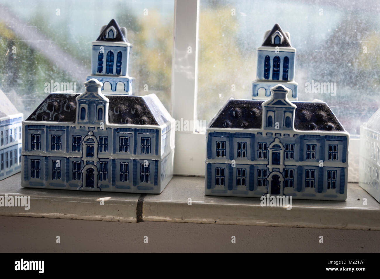 A couple of Royal Delft earthenware models of Delft Town Hall at the ...