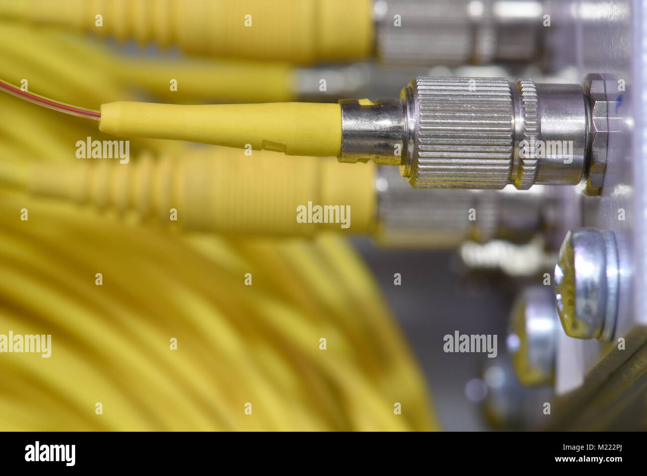 Optic fiber cables on distribution panel in data center Stock Photo - Alamy