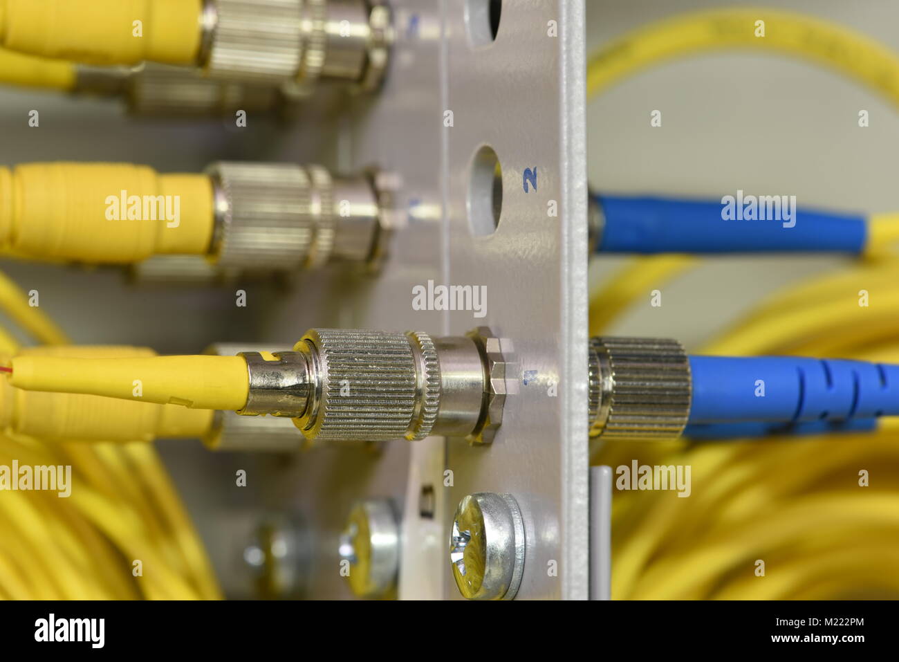 Optic fiber cables on distribution panel in data center Stock Photo - Alamy