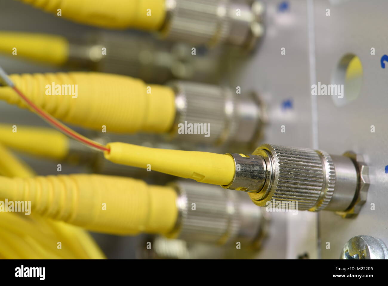 Optic fiber cables on distribution panel in data center Stock Photo - Alamy