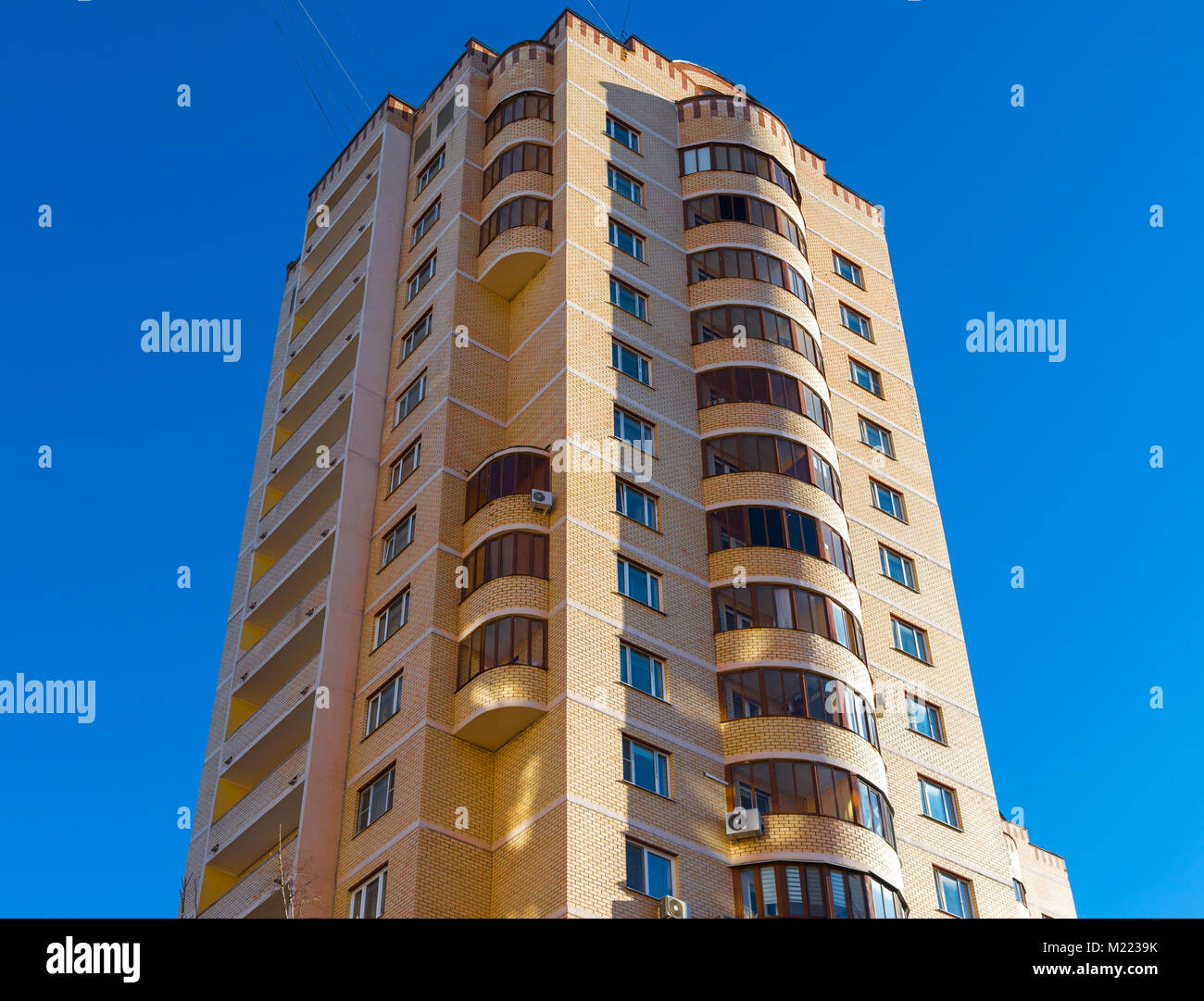 A modern single-entrance residential building made of bricks Stock ...