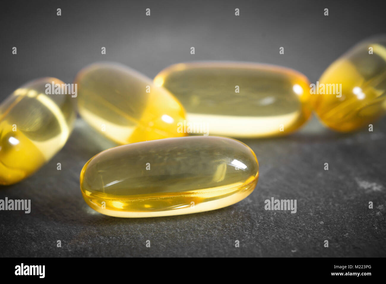 closeup of medical pills scattered on grey stone background Stock Photo ...