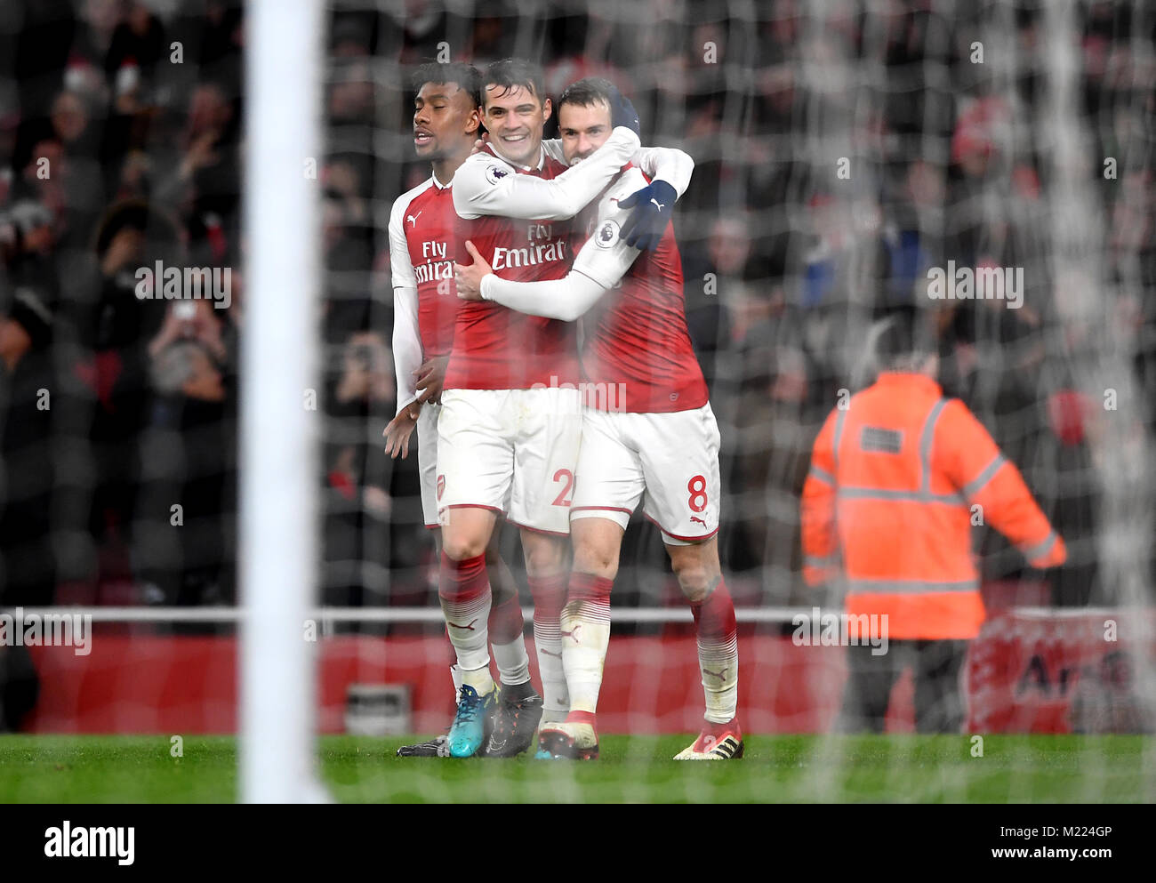 Arsenal's Aaron Ramsey (right) celebrates scoring his side's fifth goal ...
