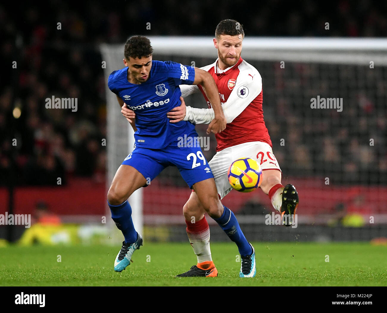 Everton's Dominic Calvert-Lewin (left) and Arsenal's Shkodran Mustafi ...