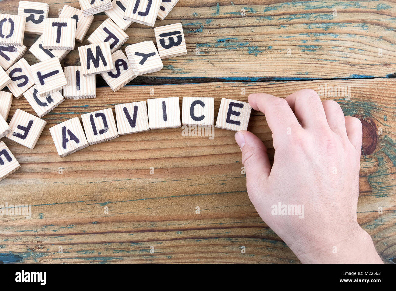 advice. Wooden letters on the office desk, informative and ...