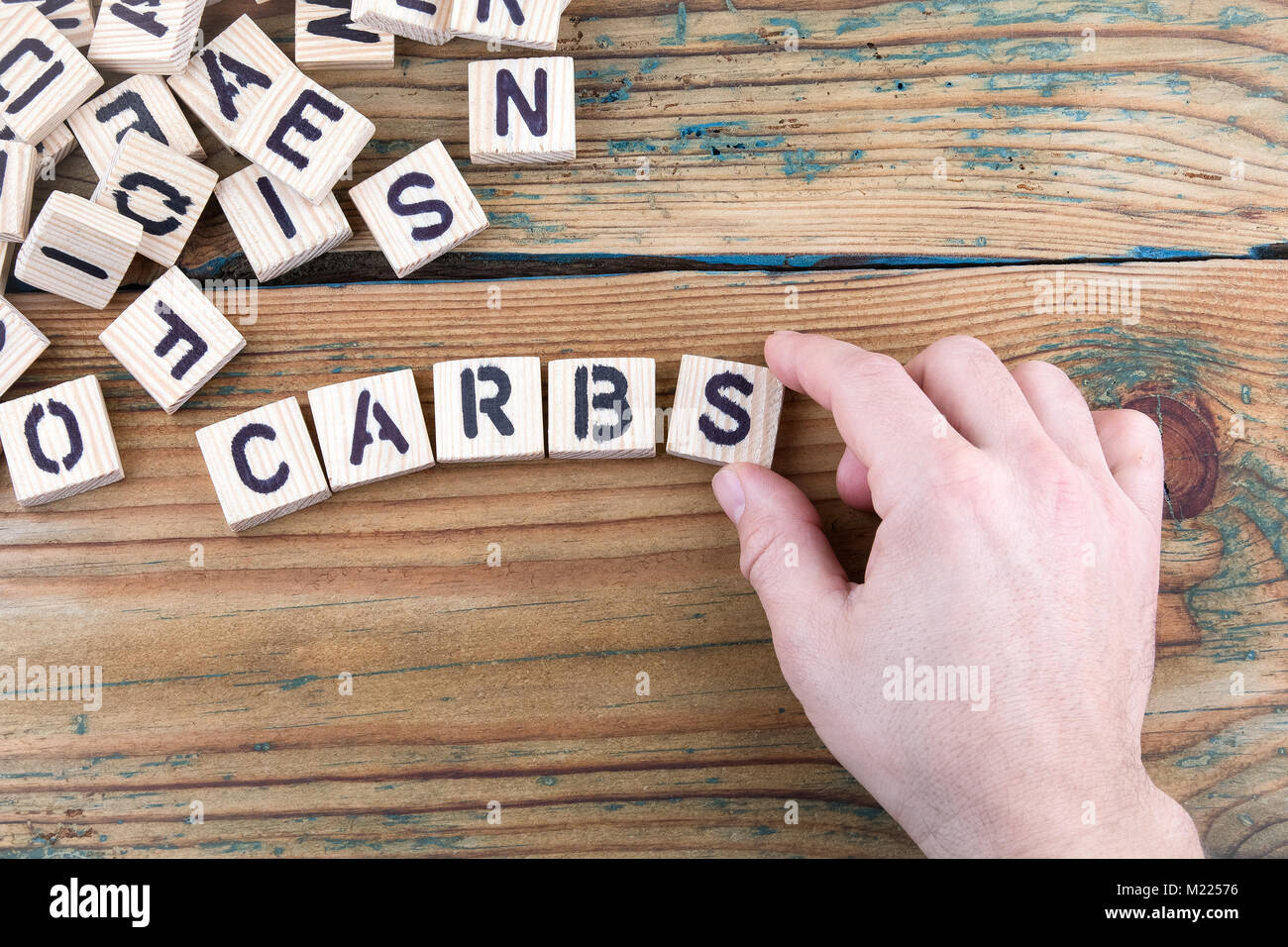 carbs. Wooden letters on the office desk, informative and communication ...