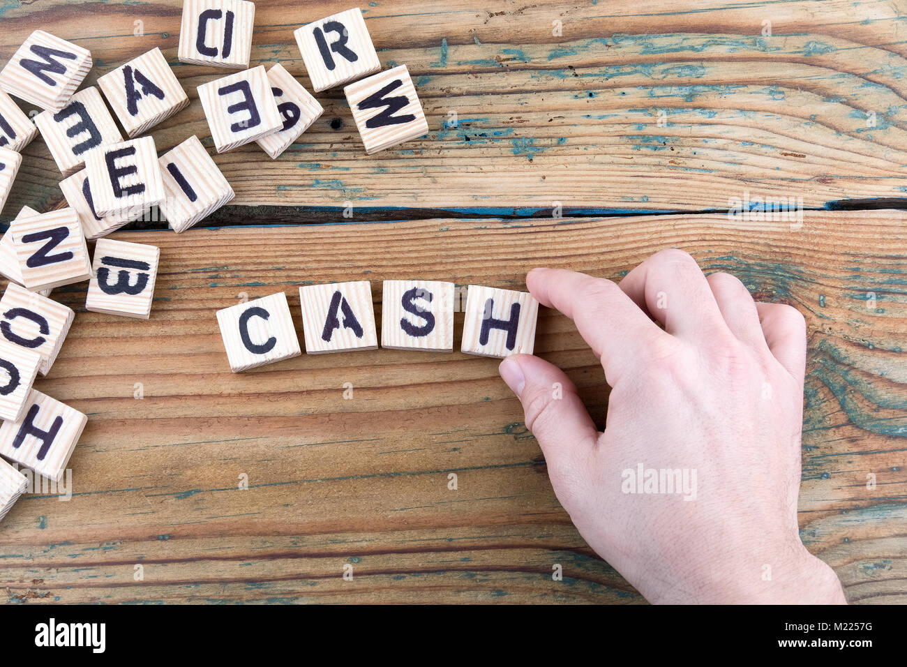 cash. Wooden letters on the office desk, informative and communication ...