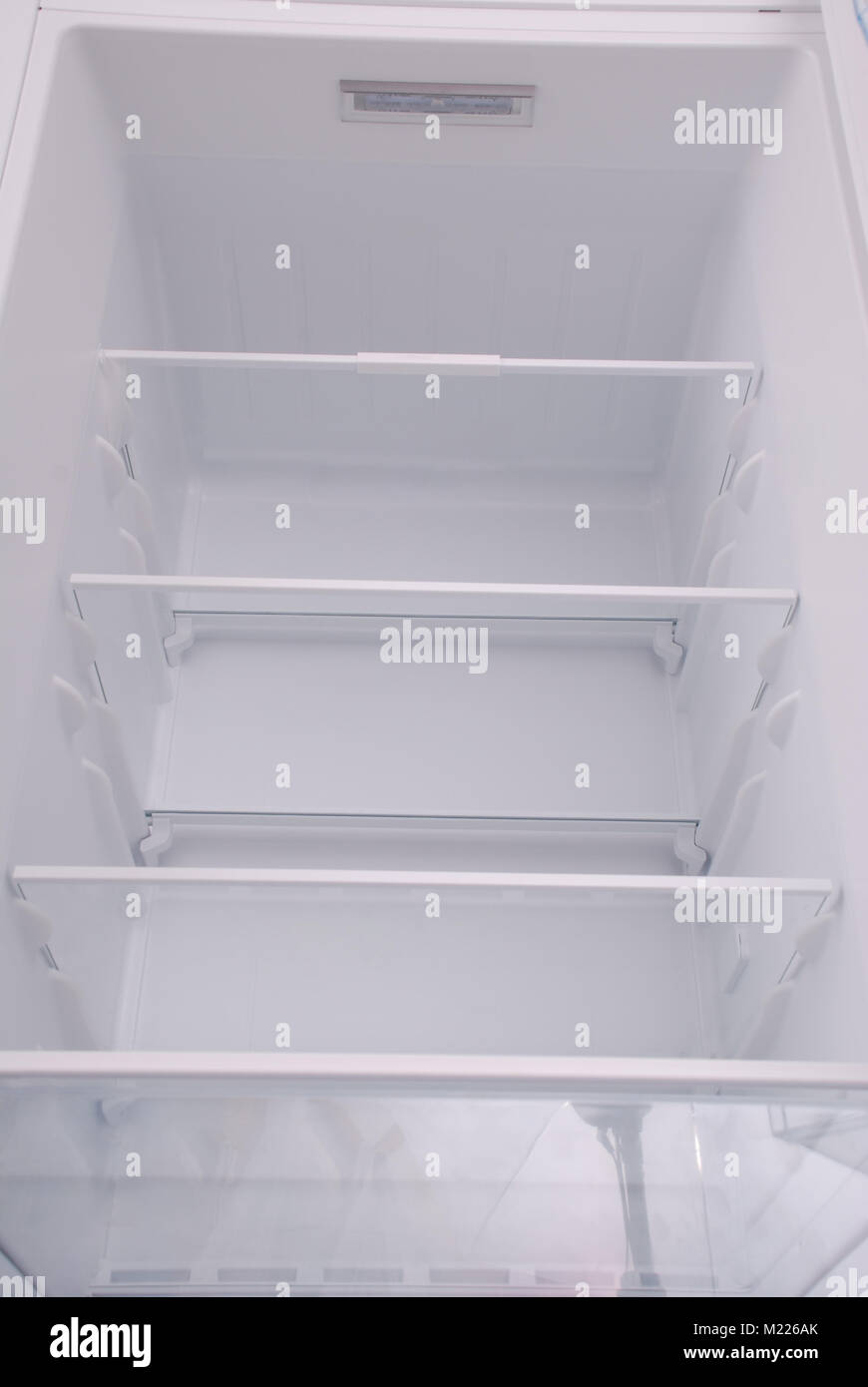 Empty clean refrigerator with opened door Stock Photo - Alamy