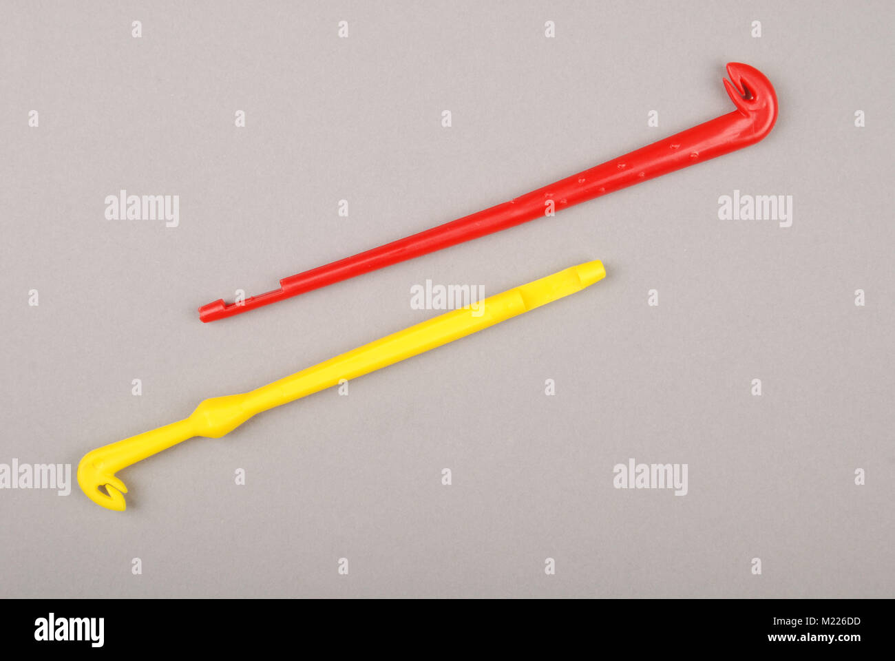 Red and yellow loop tier isolated on gray background Stock Photo - Alamy