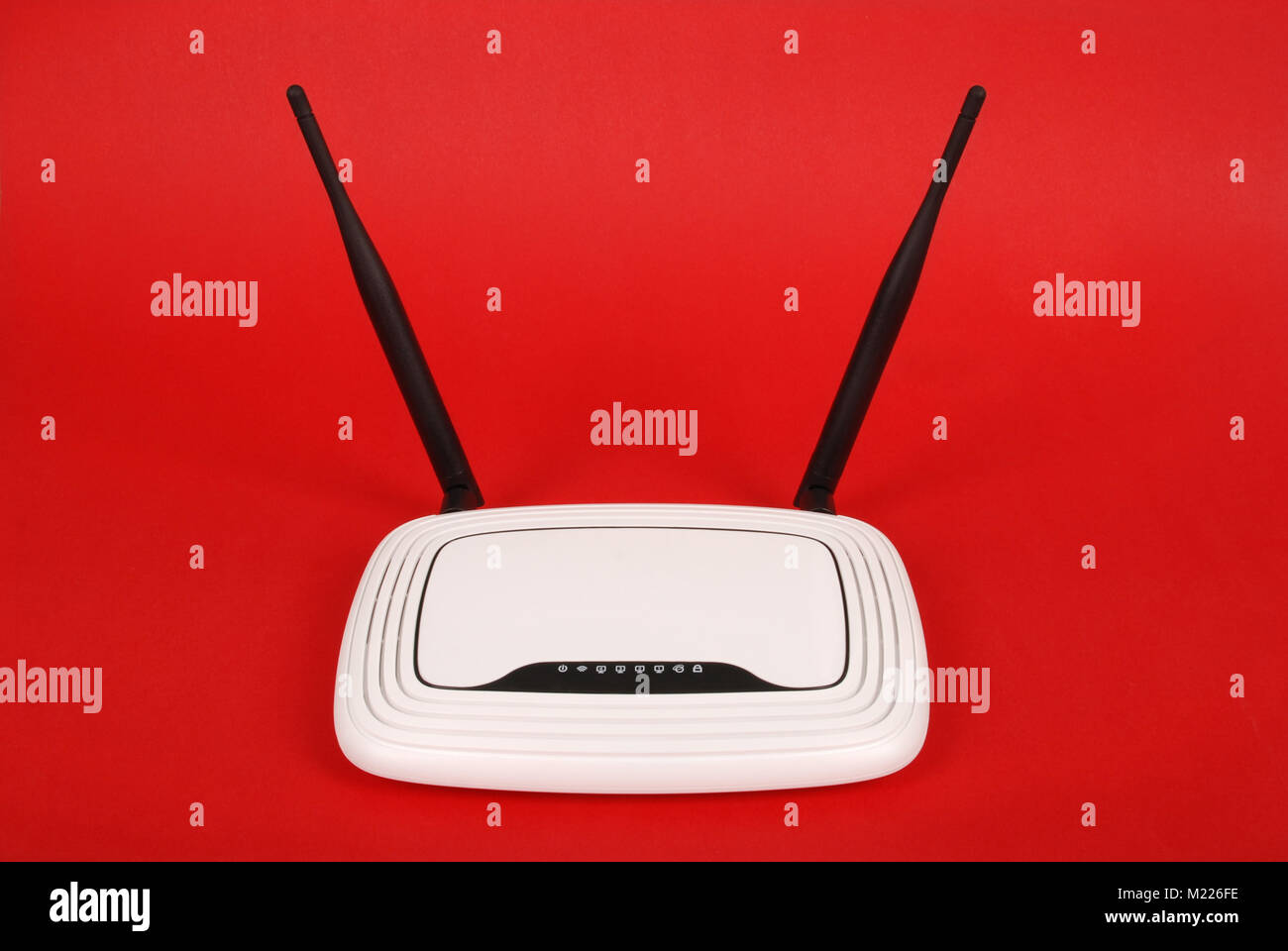 White WI-FI router with two antennas isolated on red background Stock ...