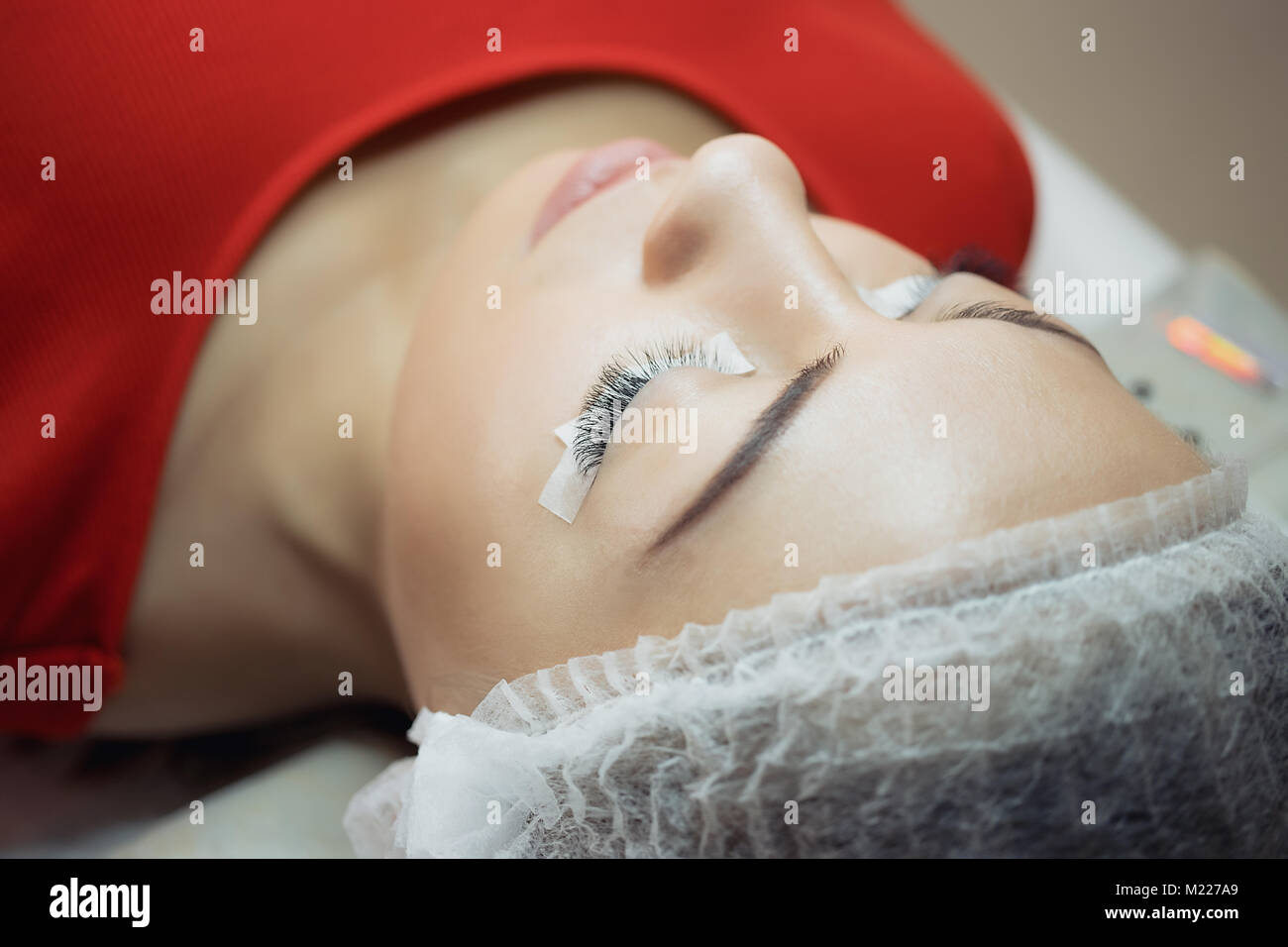 Eyelash Extension Procedure. Woman Eye with Long Eyelashes Stock Photo ...