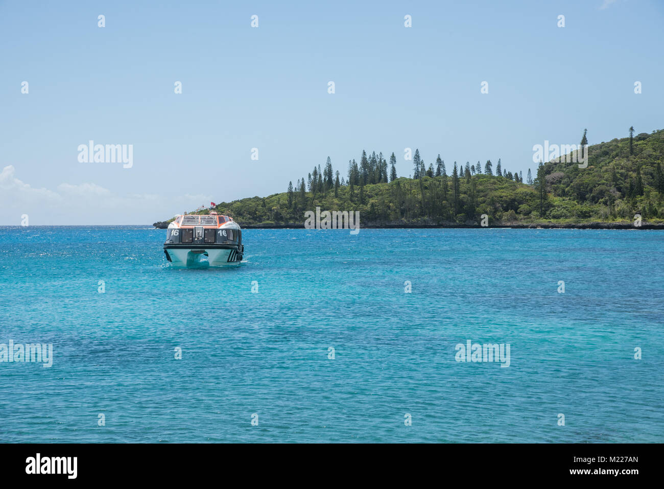 TADINE,MARE,NEW CALEDONIA-DECEMBER 3,2016: Tender boat in the pacific ...