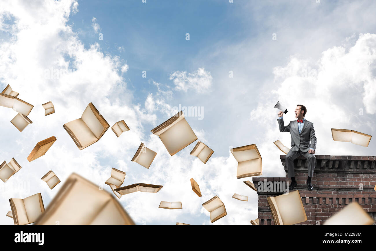 Holding on to edge of building hi-res stock photography and images - Alamy