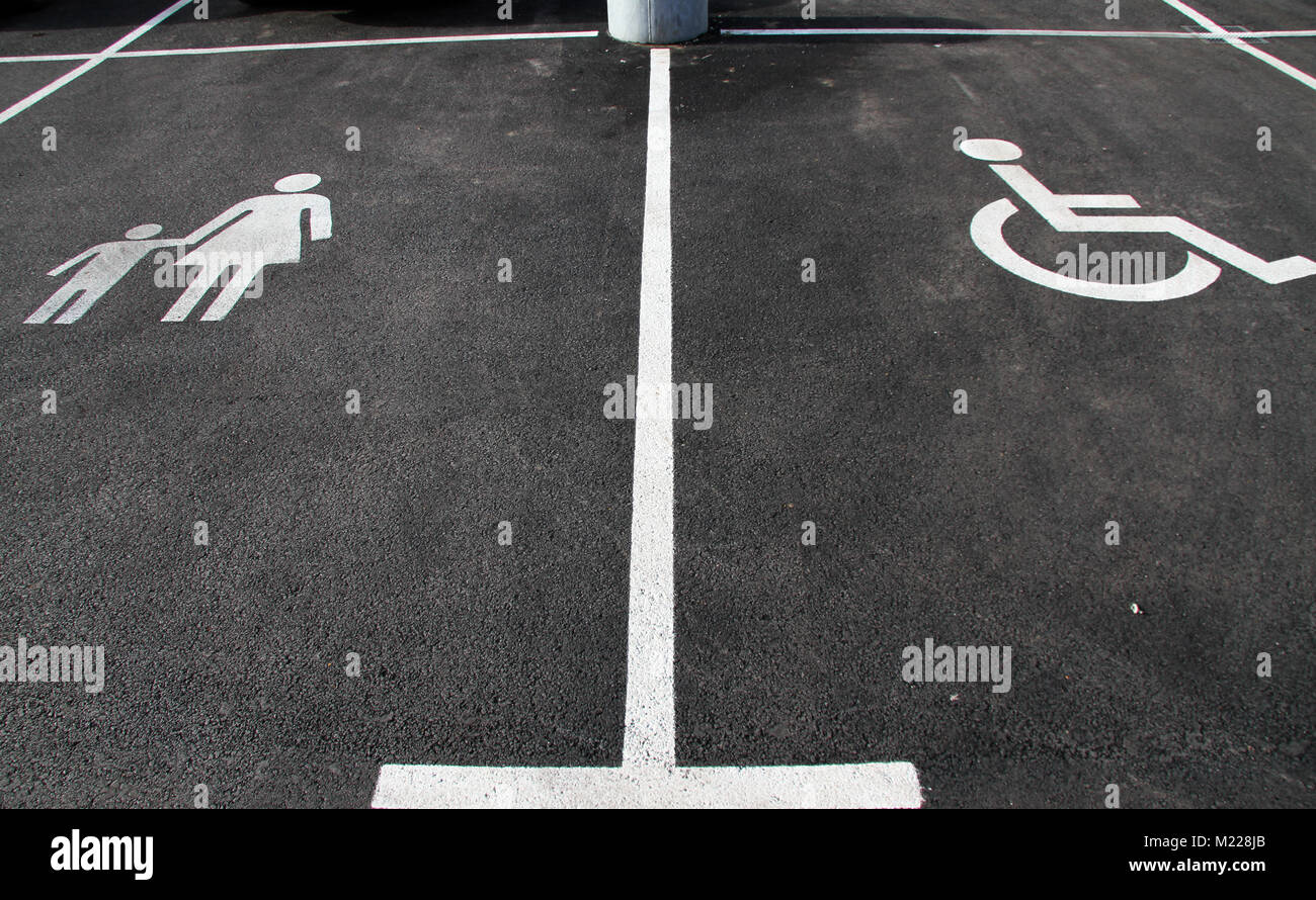 "Handicap” and “Mother with child” icons. Parking signs. Parking lot ...