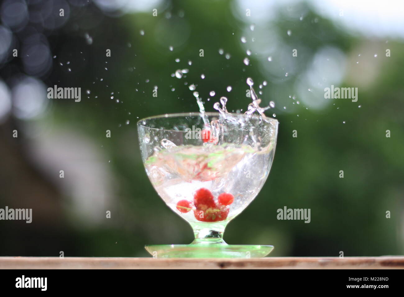 Fruit splashing in water Stock Photo - Alamy