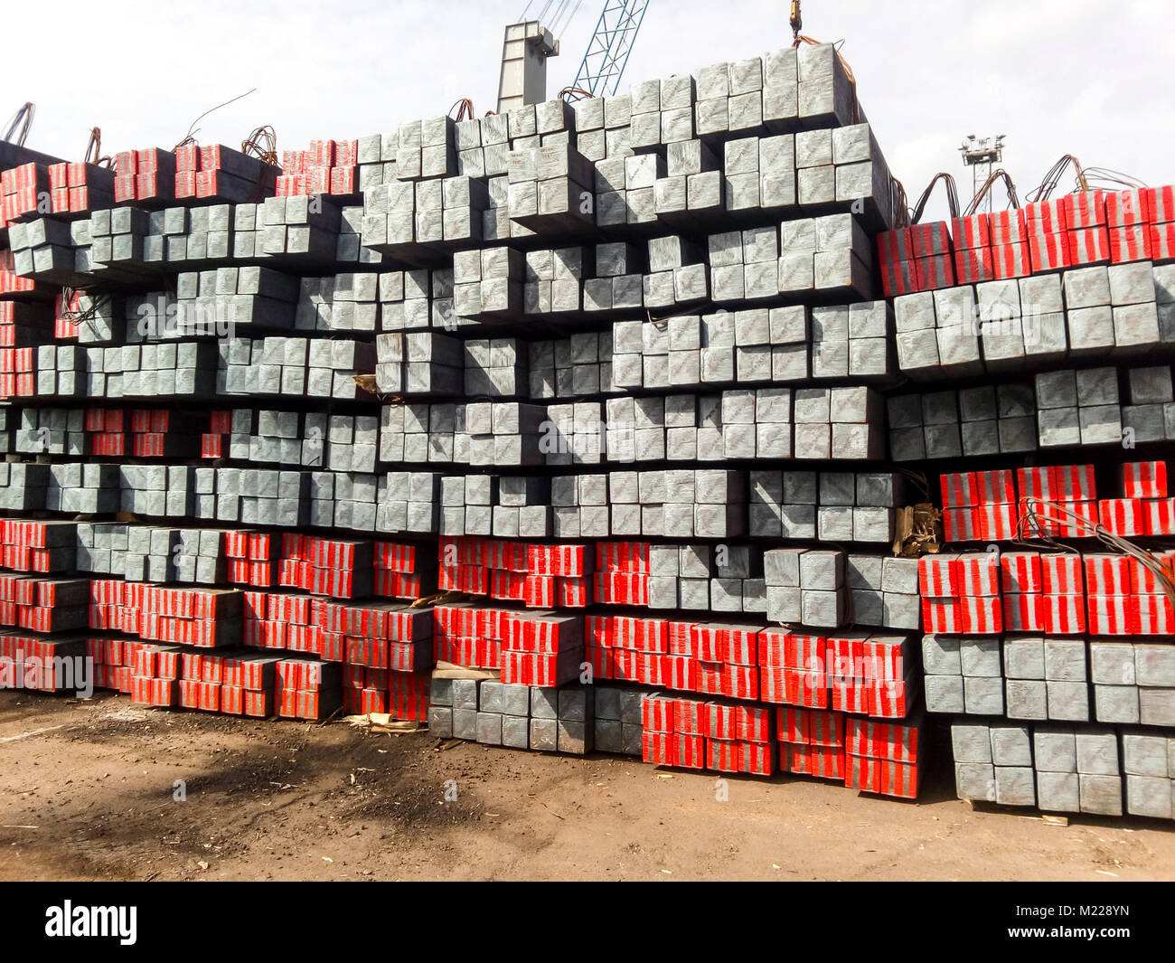 Metal square rods. Warehouse of metal ingots Stock Photo - Alamy