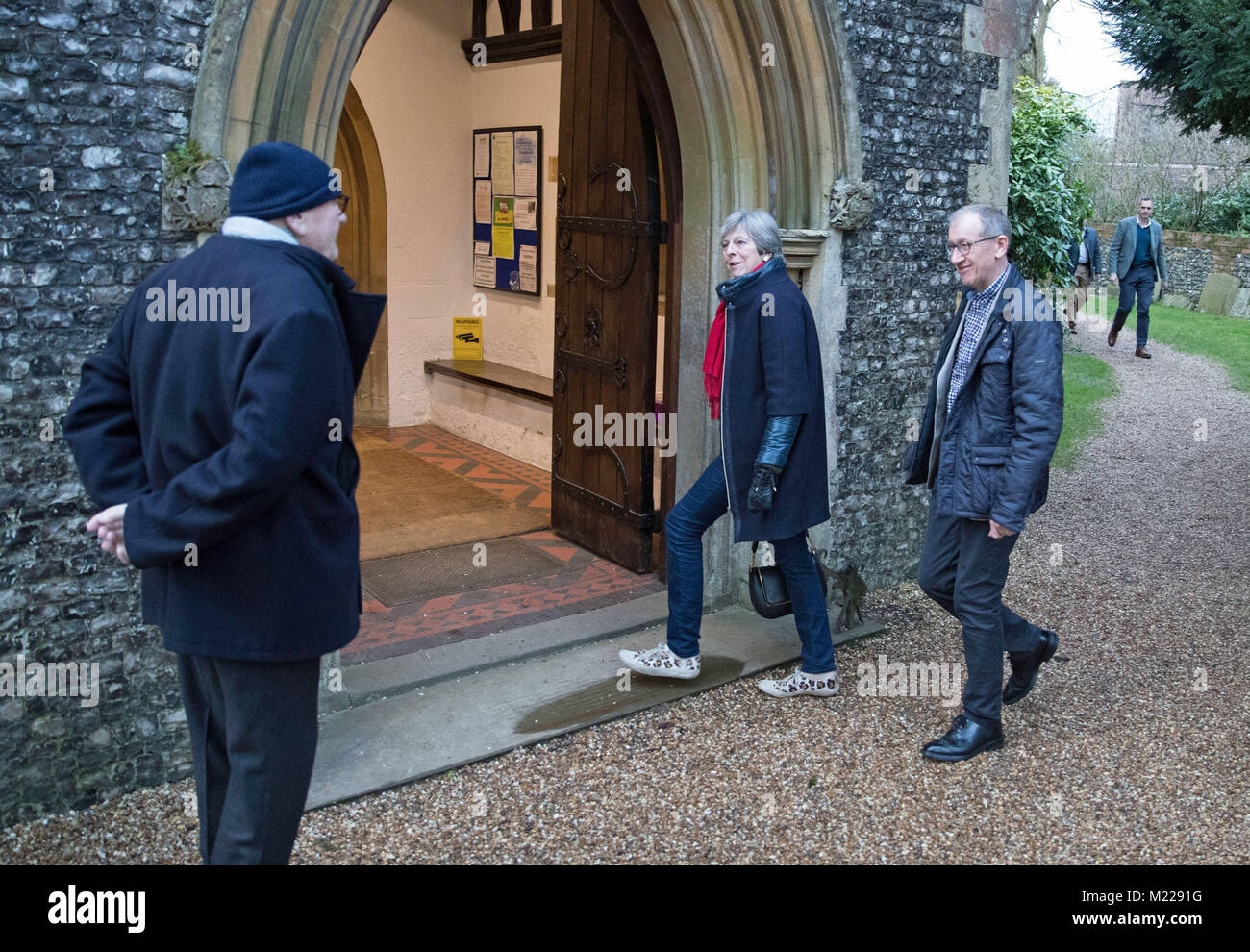 Prime Minister Theresa May and her husband Philip arrive to attend a ...