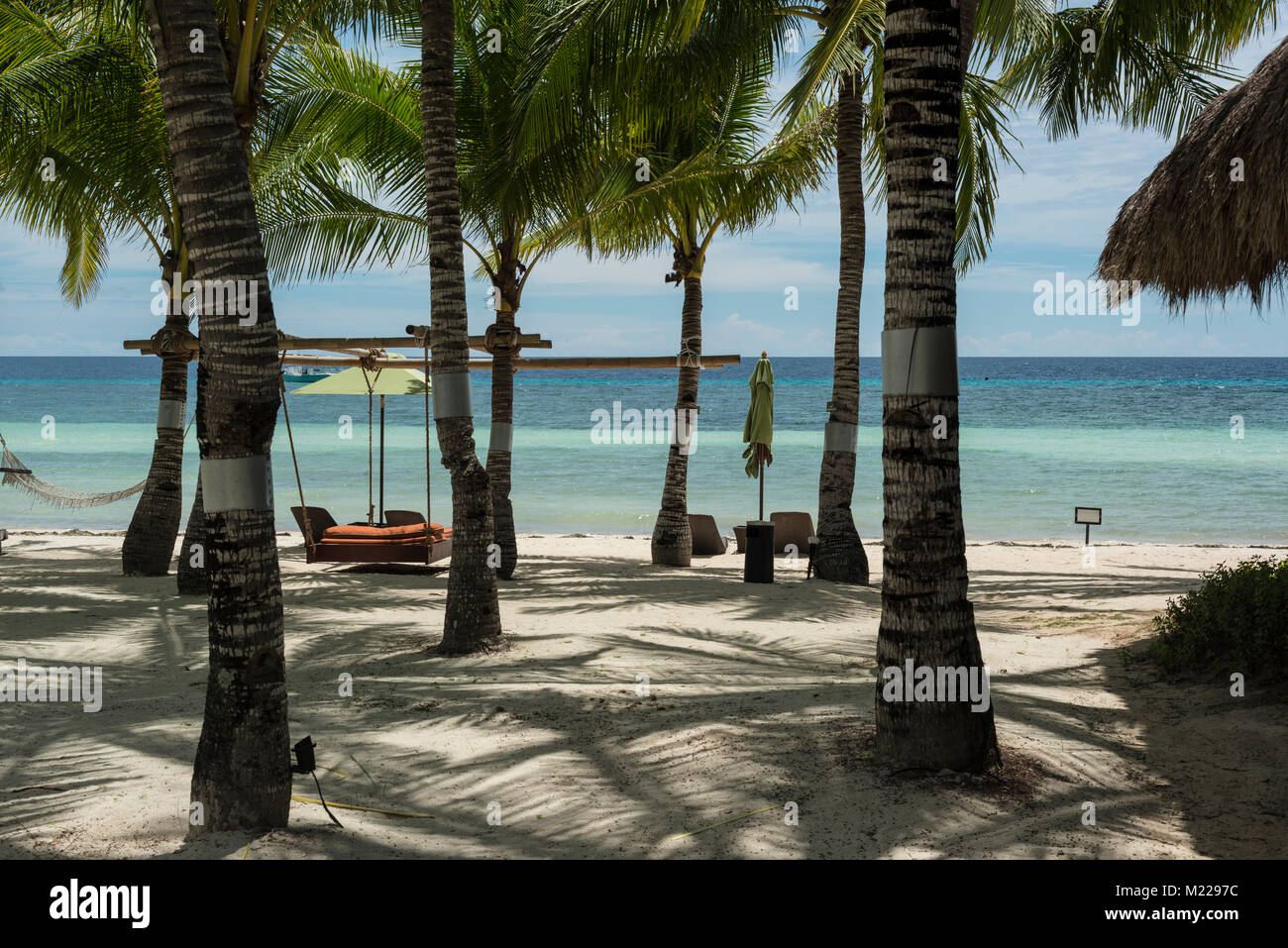 Palm trees island tropical beach waves hi-res stock photography and ...