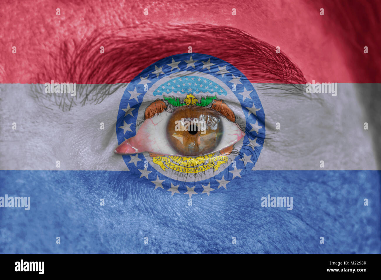Human face and eye painted with US state flag of Missouri Stock Photo ...