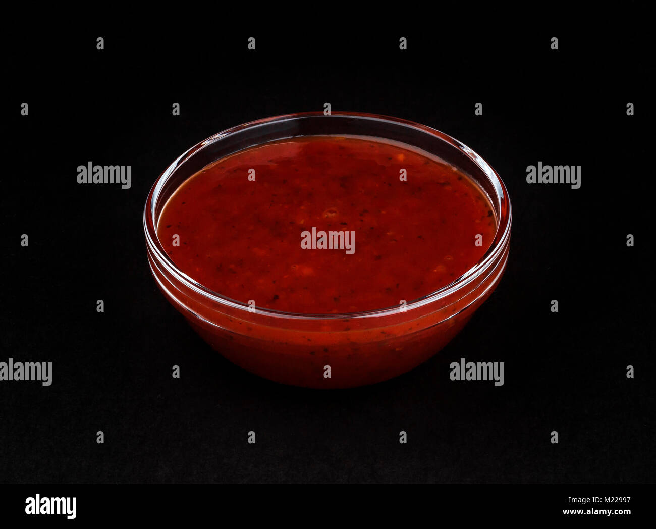 Red sauce isolated on black background Stock Photo - Alamy