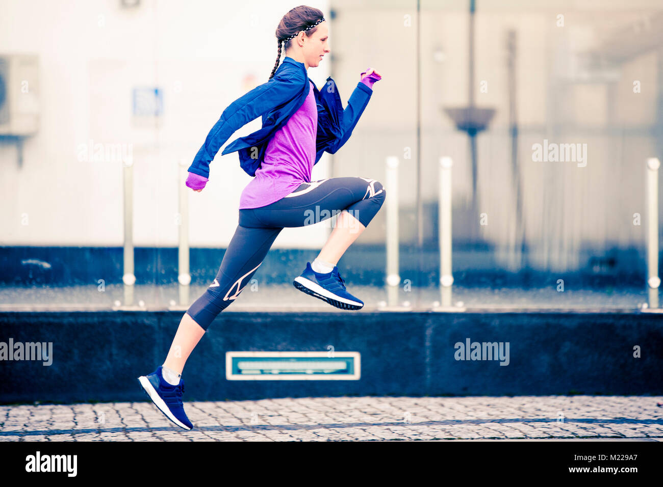 Woman running in the City Stock Photo - Alamy
