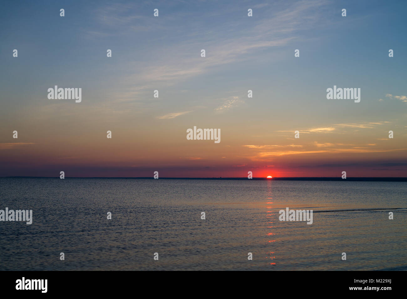 Calm sunset on the beach hi-res stock photography and images - Alamy
