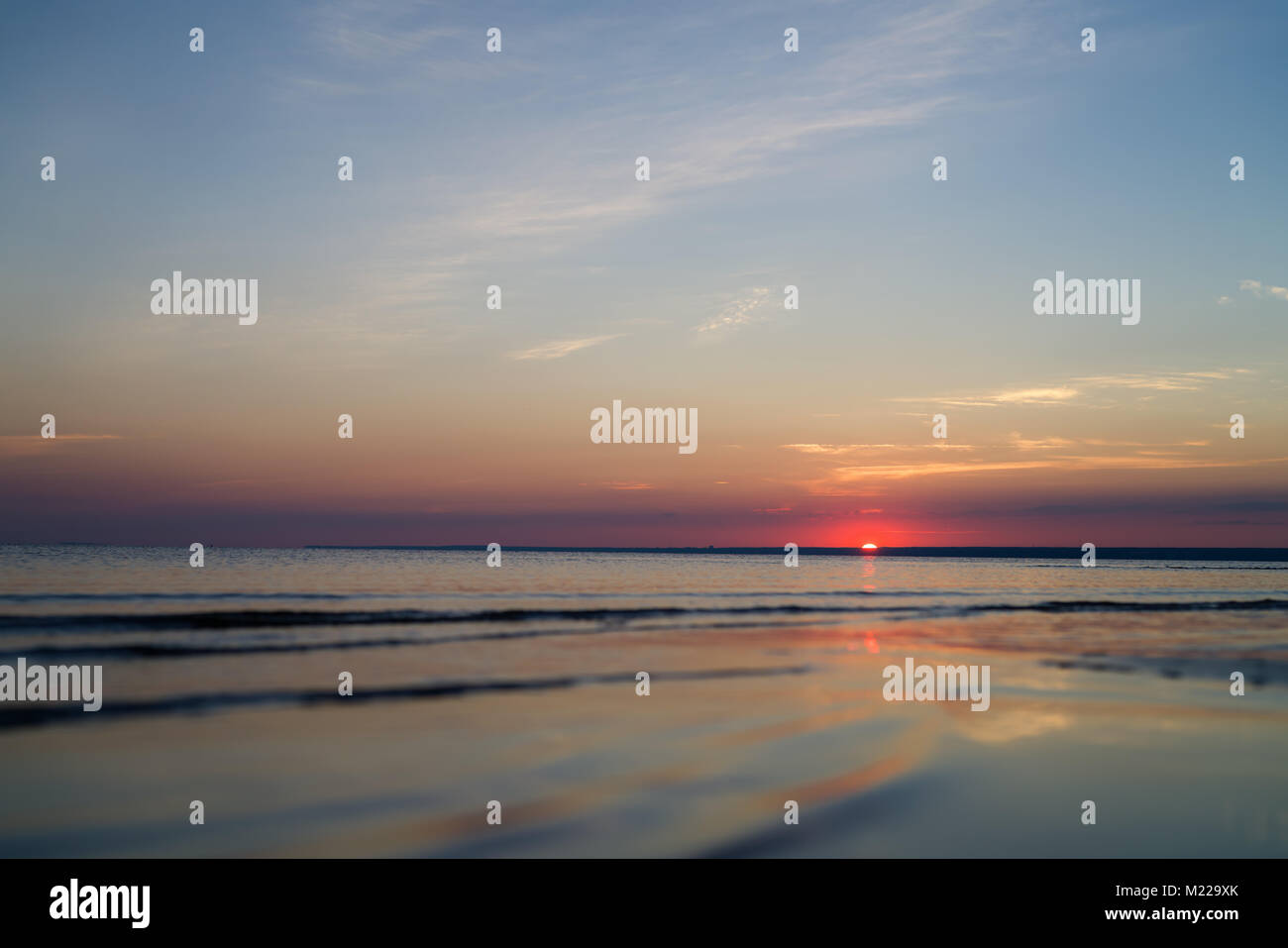 Calm sunset on the beach hi-res stock photography and images - Alamy